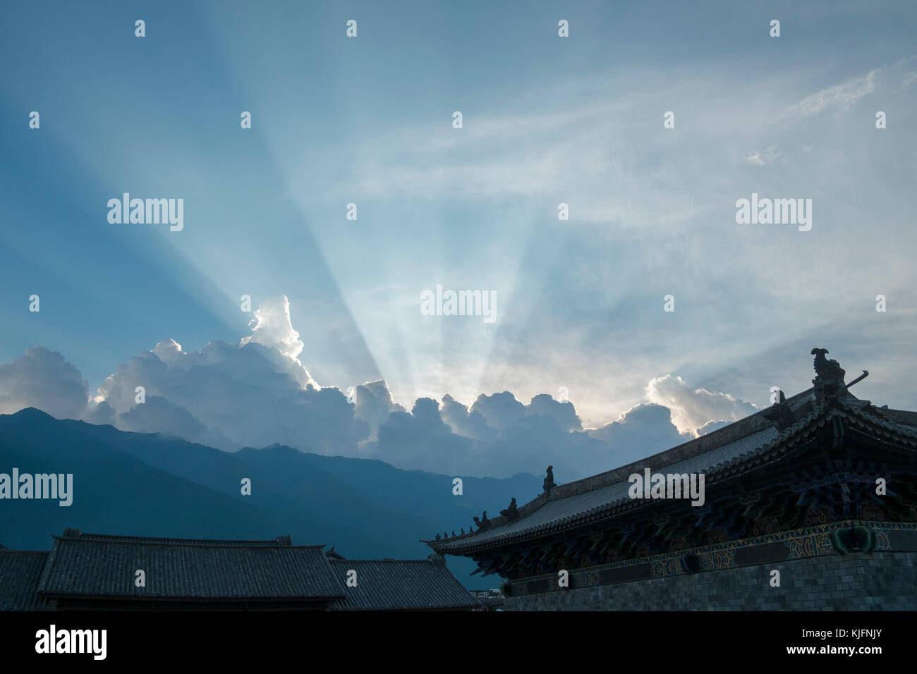 View of sun shining throughing the clouds in Dali, Yunnan province of ...