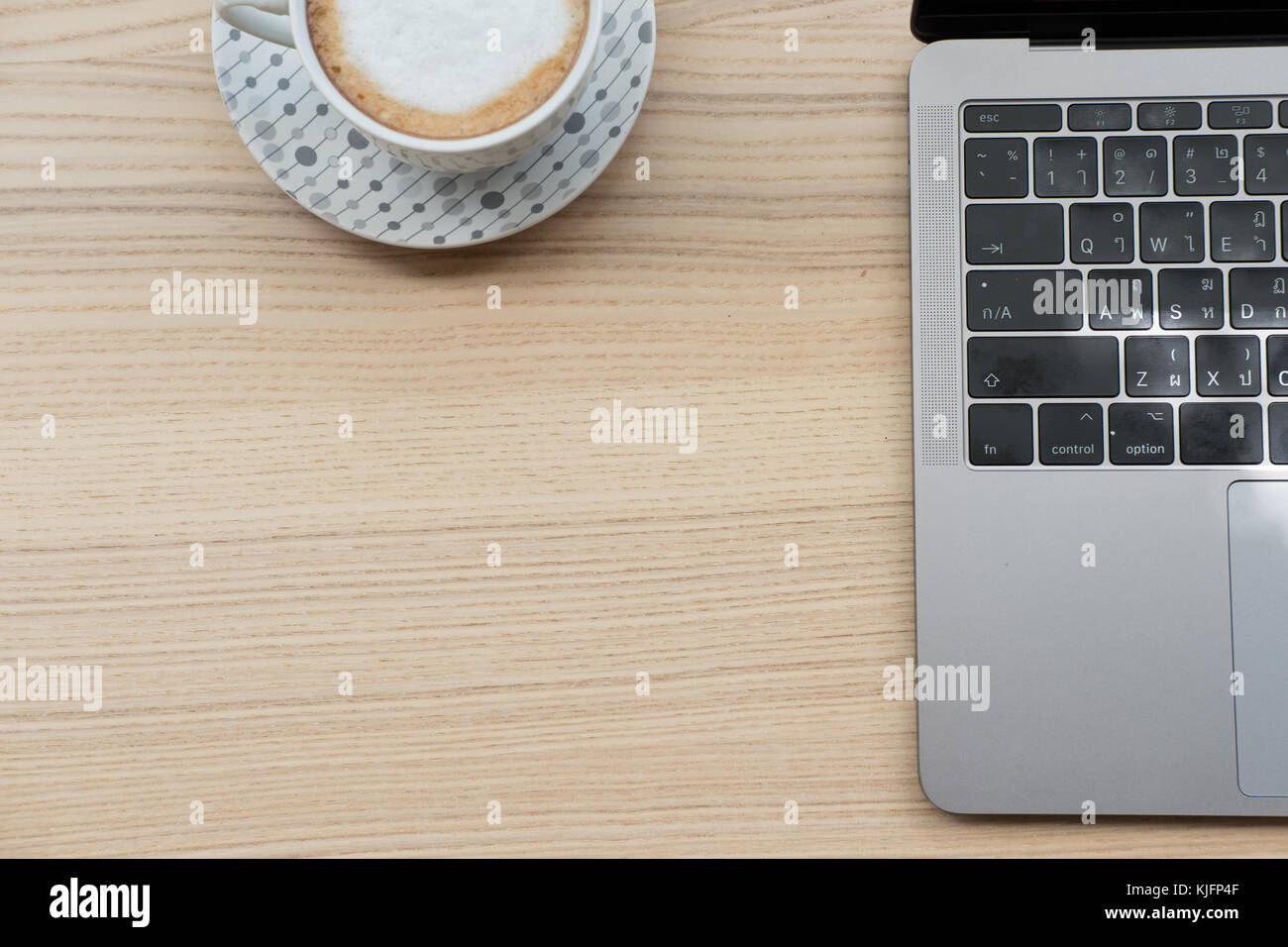 computer notebook, coffee cup on wood desk. laptop at office workplace ...