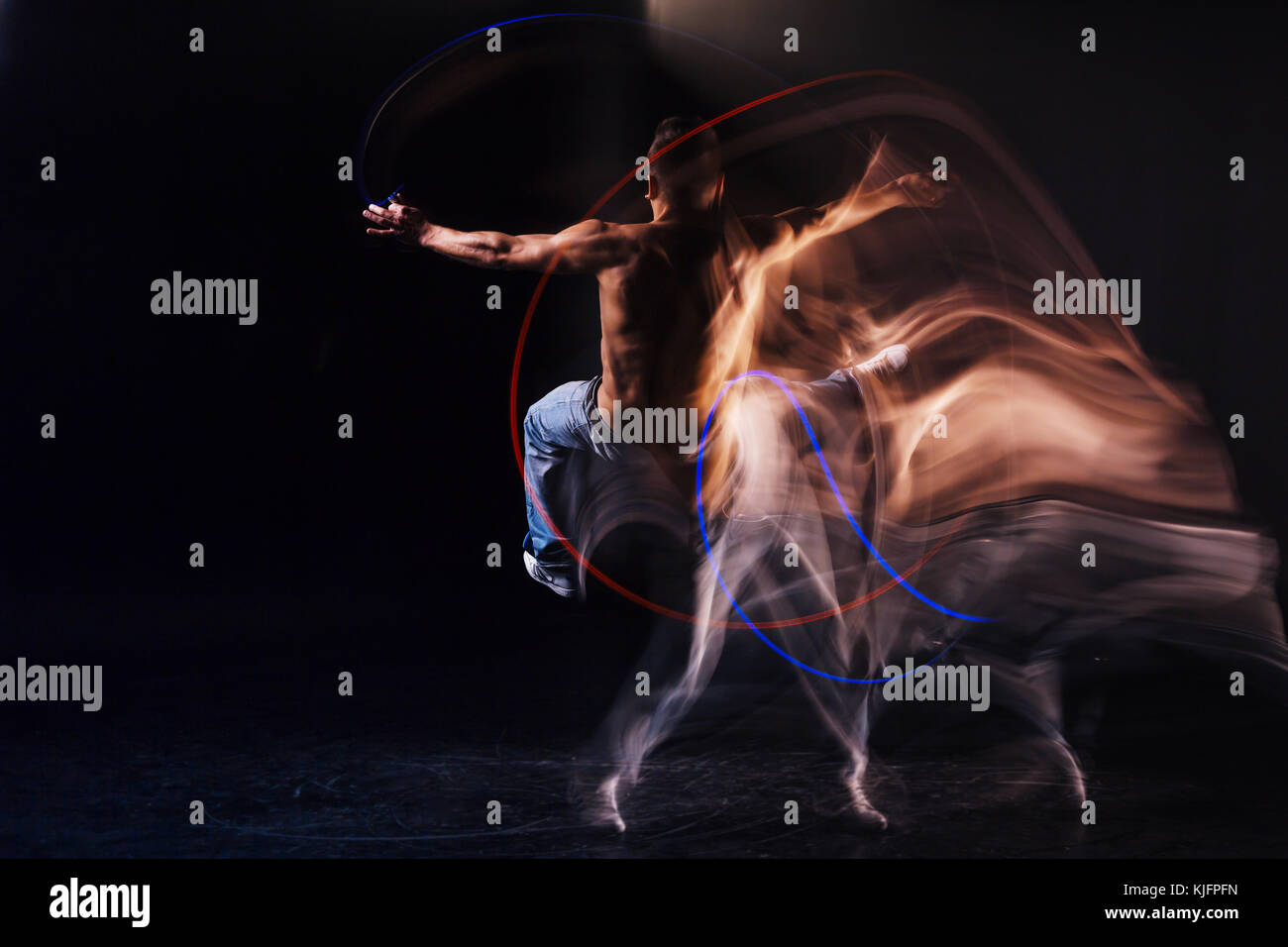 Handsome well built man jumping Stock Photo - Alamy