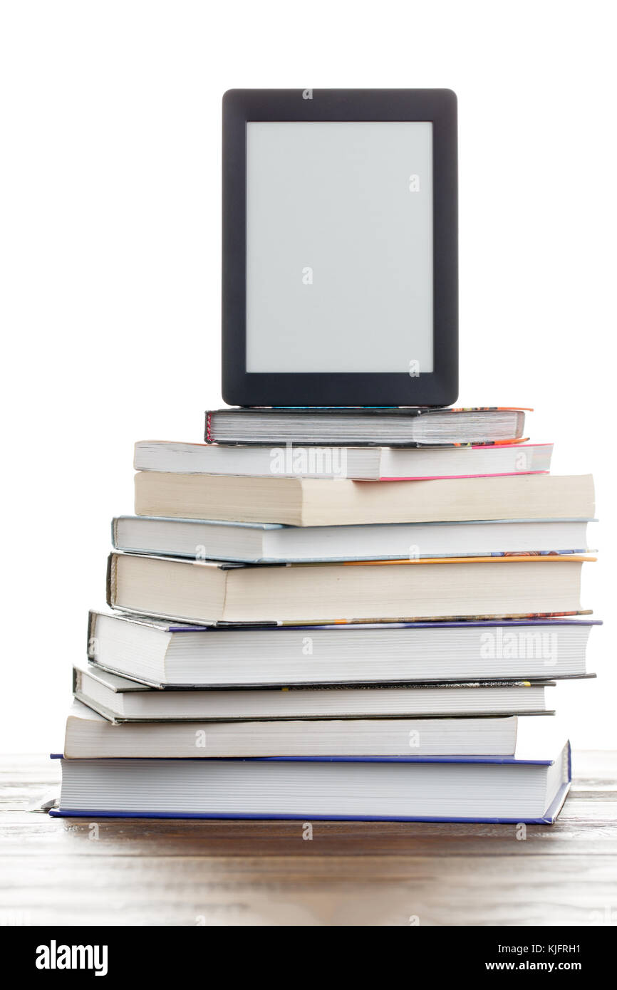 Picture of empty black picture frame on stack of books on empty ...