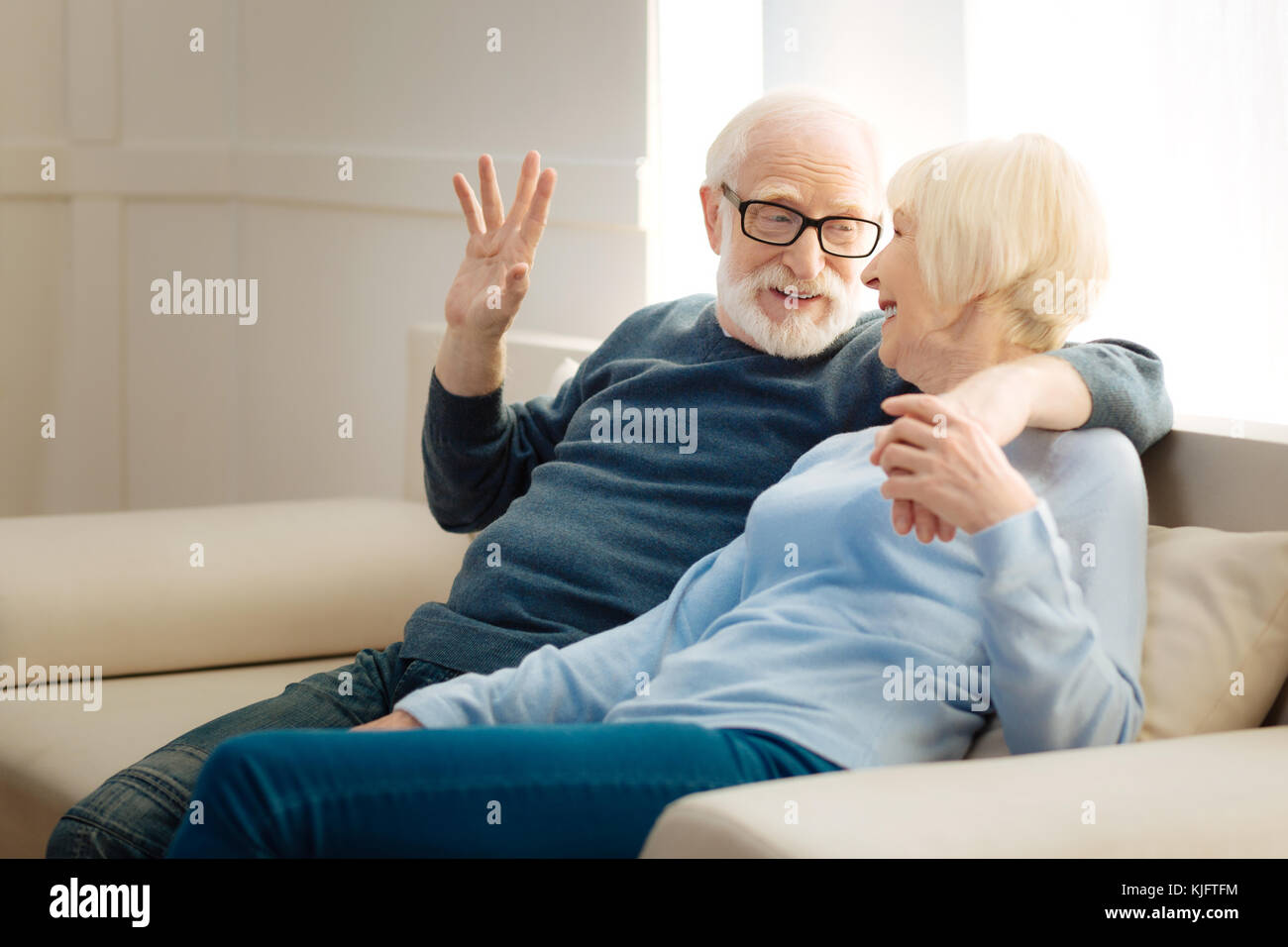 Positive delighted couple talking hi-res stock photography and images ...