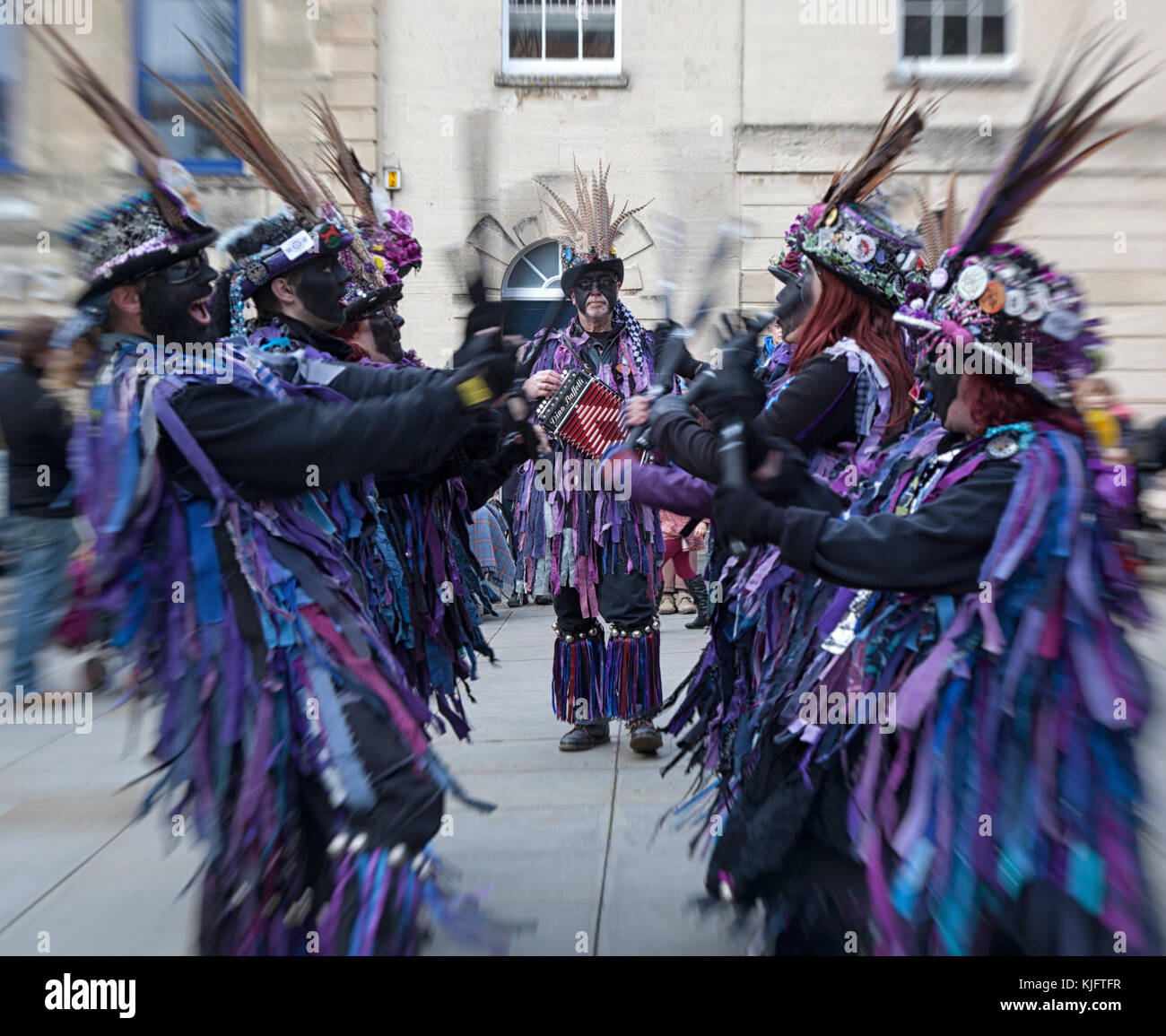 Morris dancers with disguised faces and staves perform at the Stroud ...