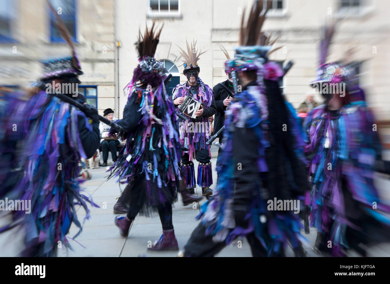 Morris dancers with disguised faces and staves perform at the Stroud ...