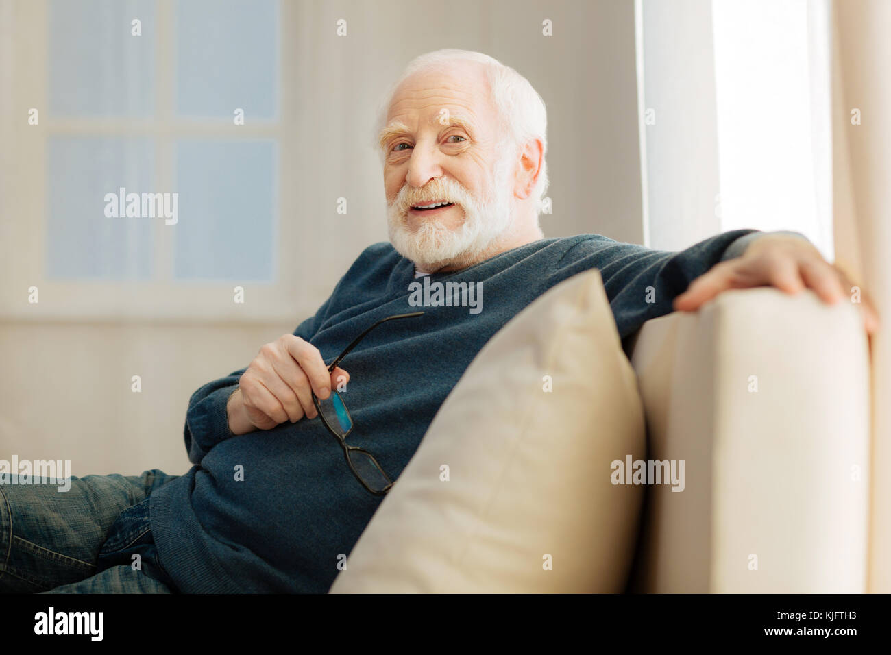 Relaxed old man posing on camera Stock Photo - Alamy