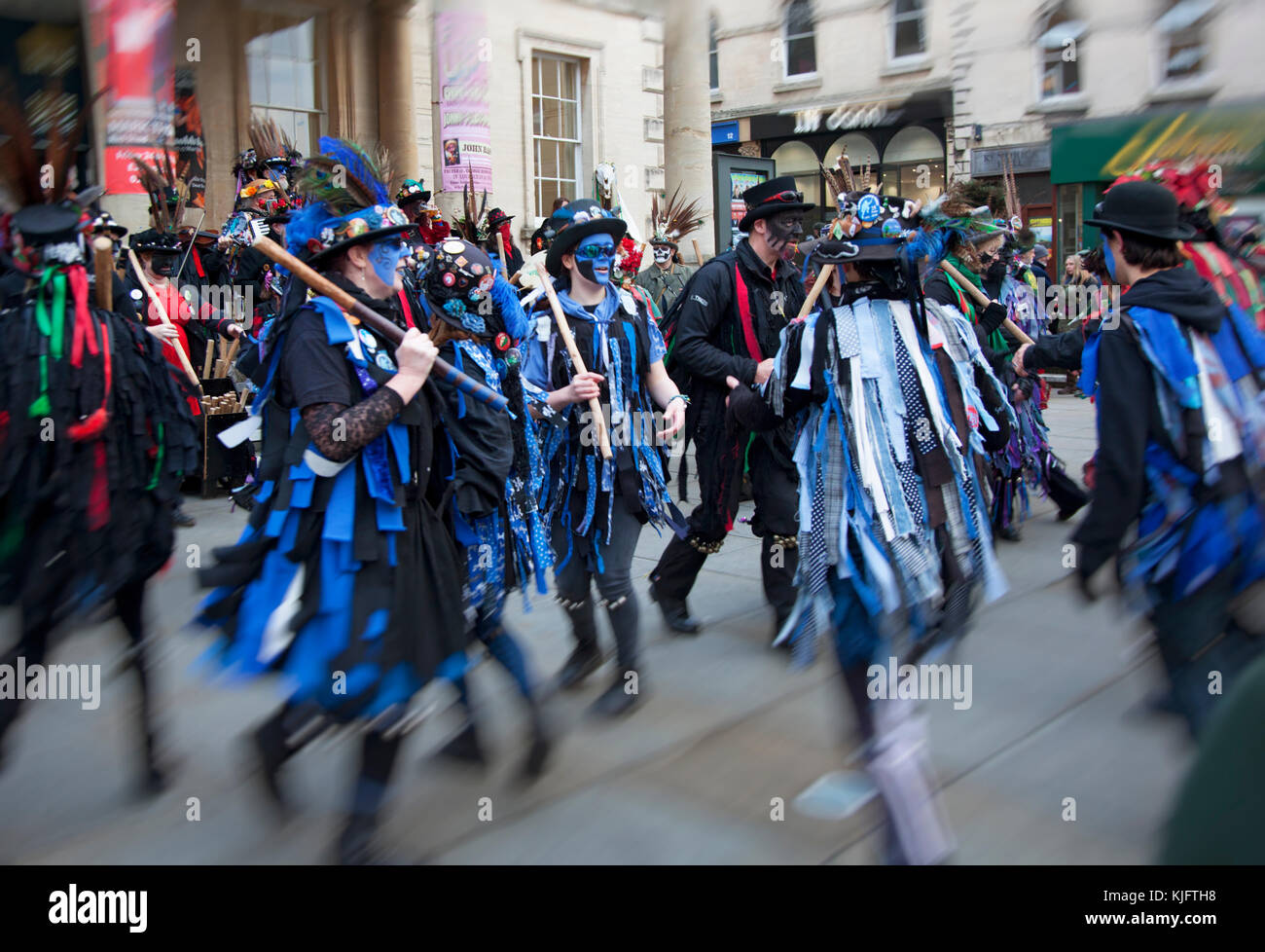 Morris dancers with disguised faces and staves perform at the Stroud ...