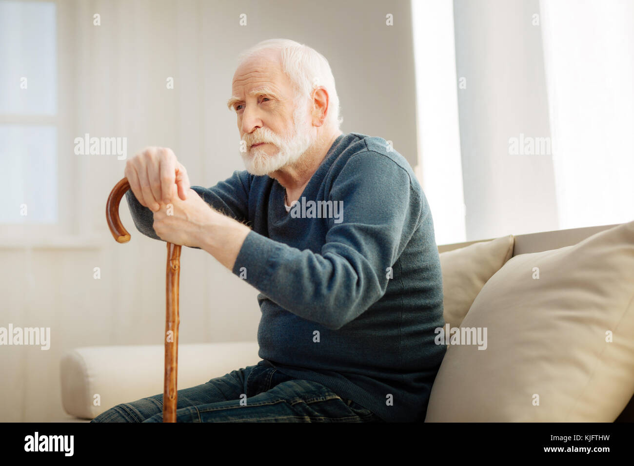 Serious mature male being deep in thoughts Stock Photo - Alamy