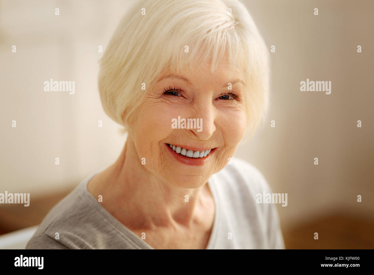 Charming mature woman looking forward Stock Photo - Alamy