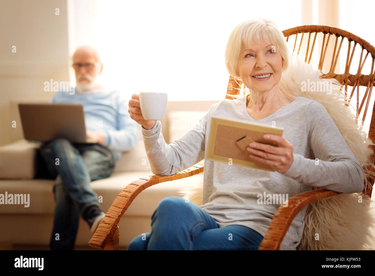 Dreamy blonde having relaxed evening Stock Photo - Alamy