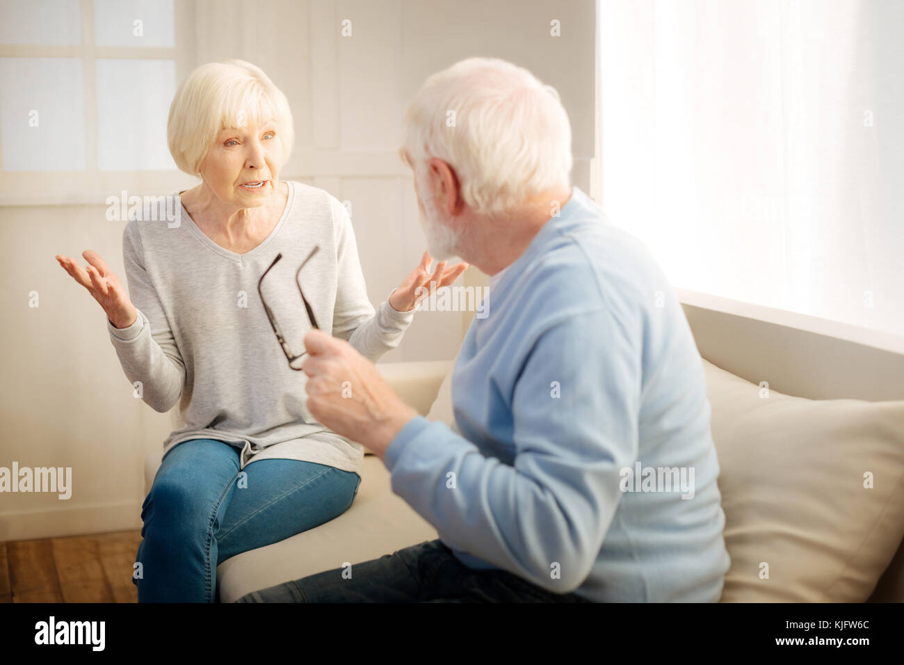 Disturbed female person actively gesticulating Stock Photo - Alamy
