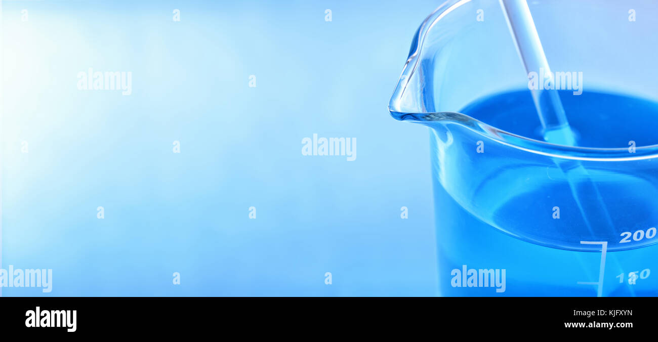 Laboratory glass chemical container with blue background. Horizontal ...