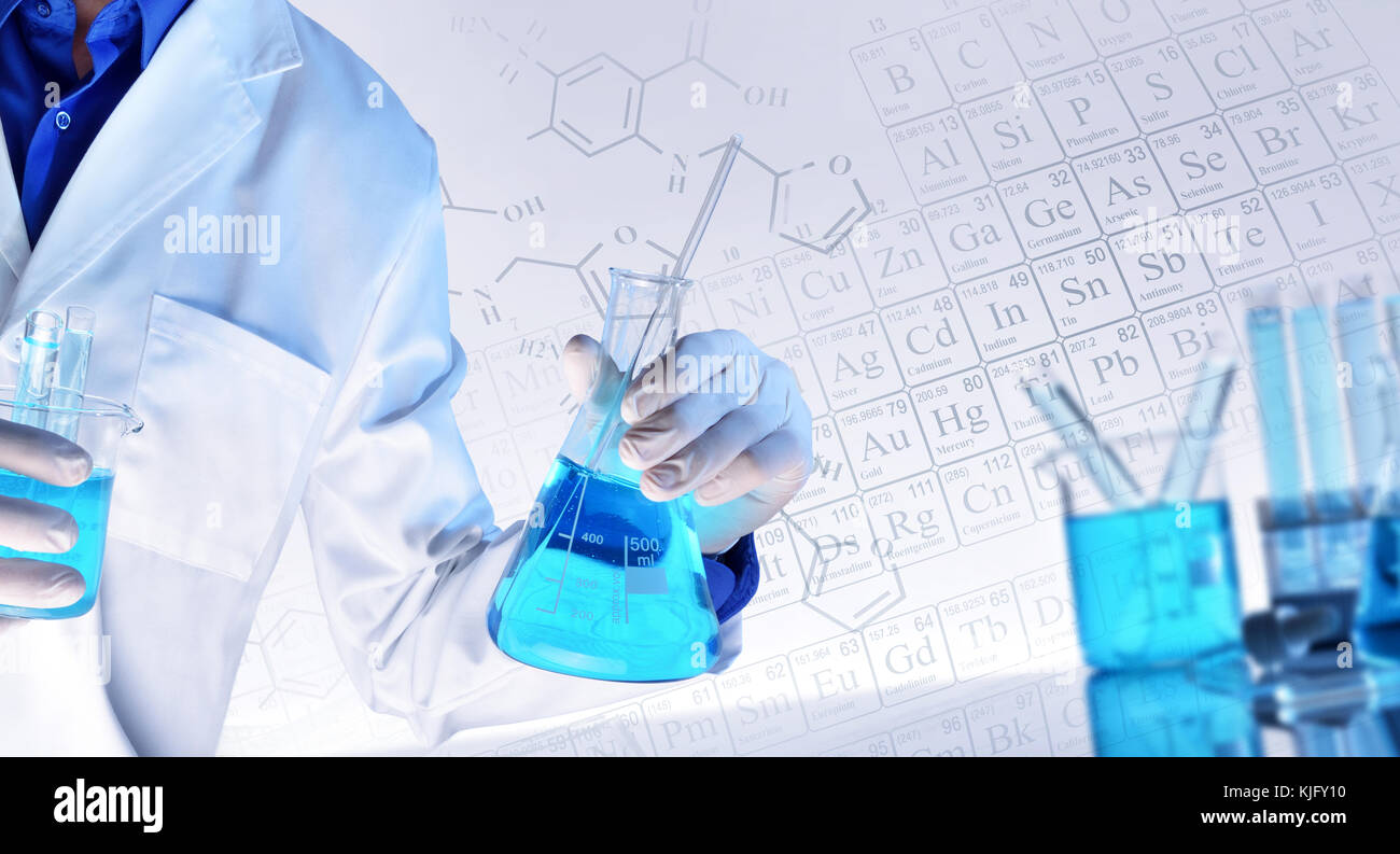 Worker equipped with workwear and laboratory chemical material with ...