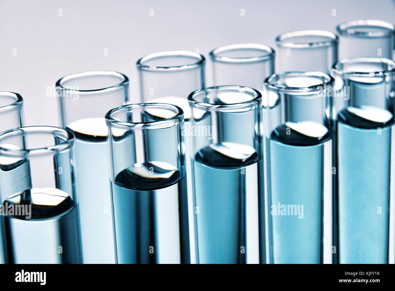 Two rows of full glass test tubes background. Elevated view Stock Photo ...