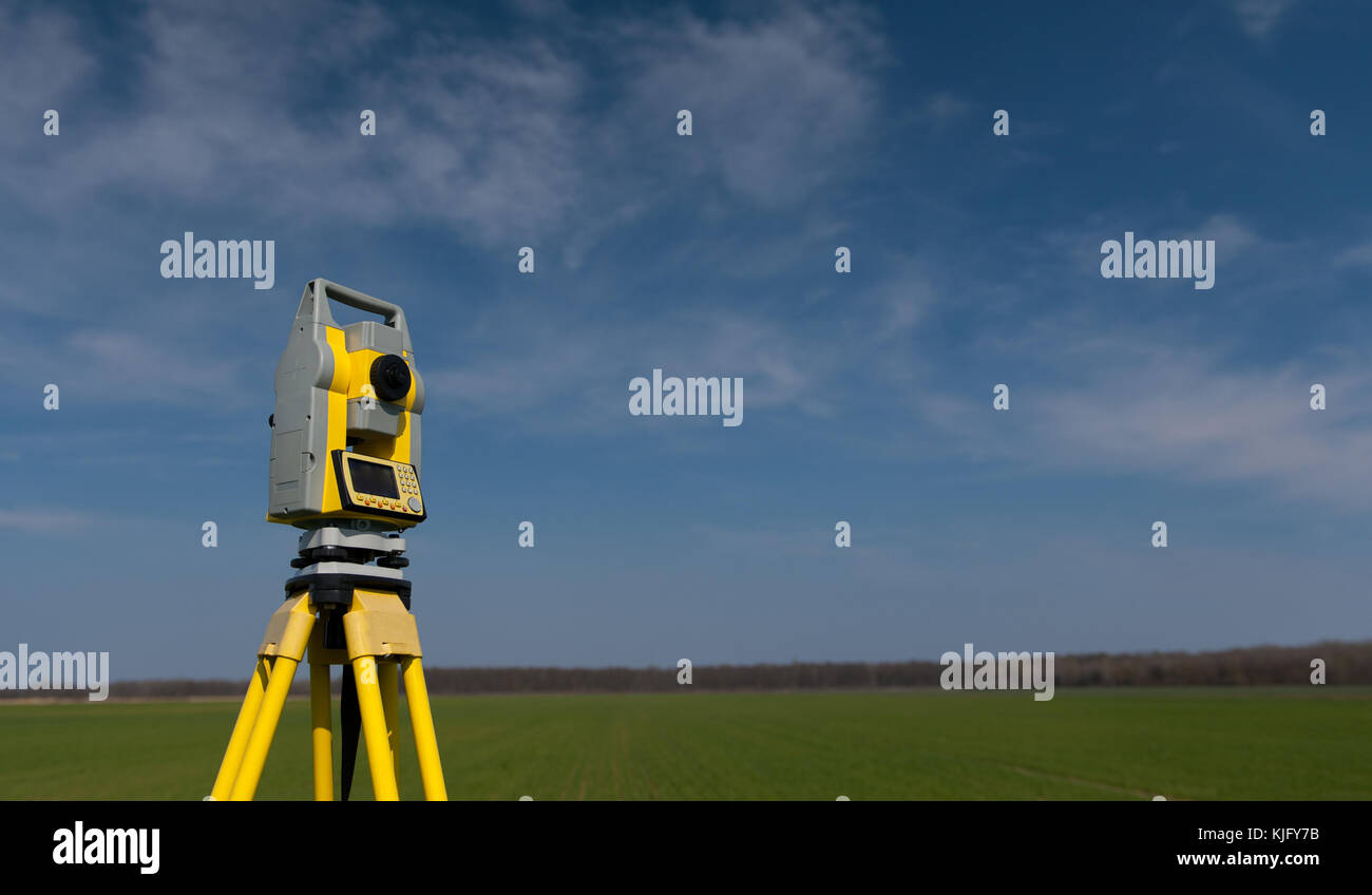 Surveyor equipment theodolite on tripod , panorama Stock Photo - Alamy