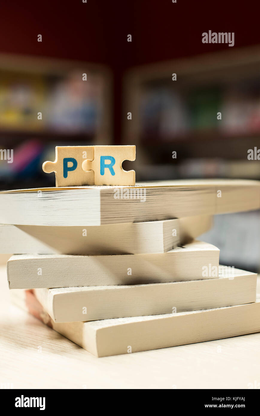 PR puzzle letters. Word PR over books in bookstore Stock Photo - Alamy