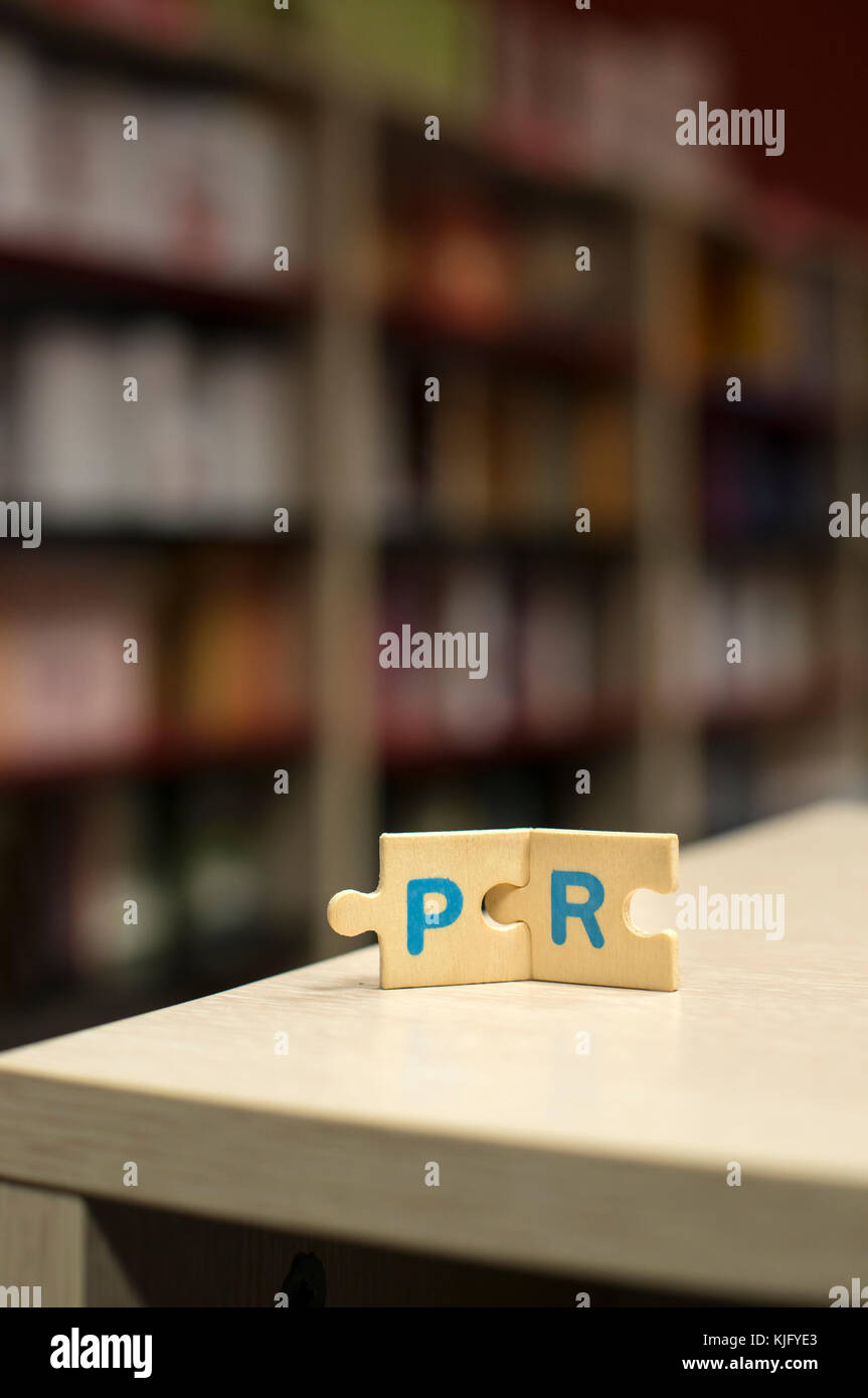 PR puzzle letters. Word PR in bookstore. Close up Stock Photo - Alamy