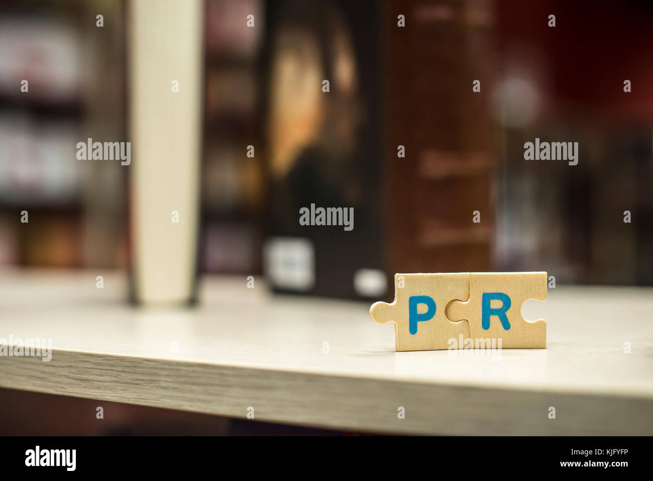 PR puzzle letters. Word PR in bookstore. Close up Stock Photo - Alamy