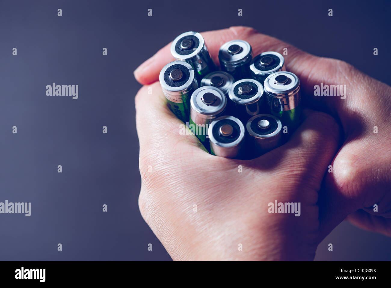 Hand hold many batteries. Close up Stock Photo - Alamy