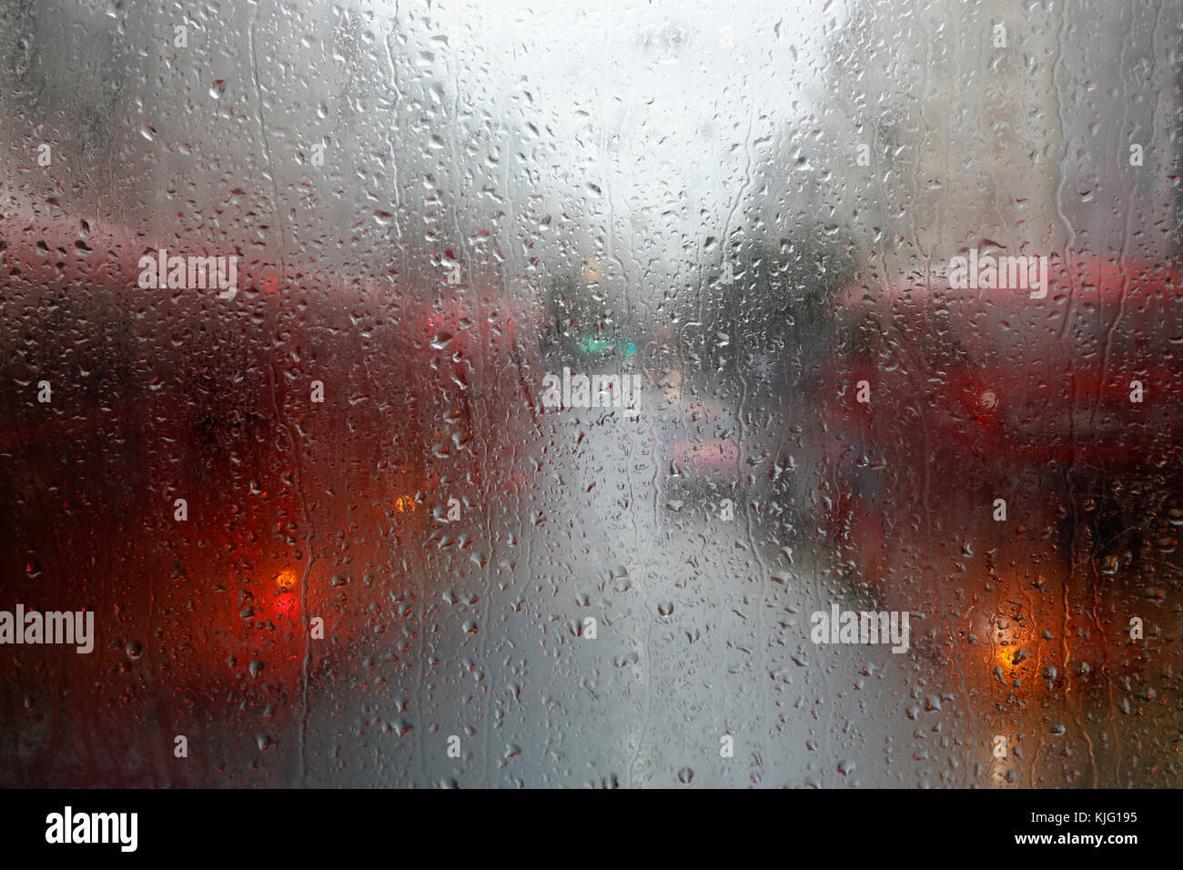 Looking through a wet London bus window on Oxford Street in the rain ...