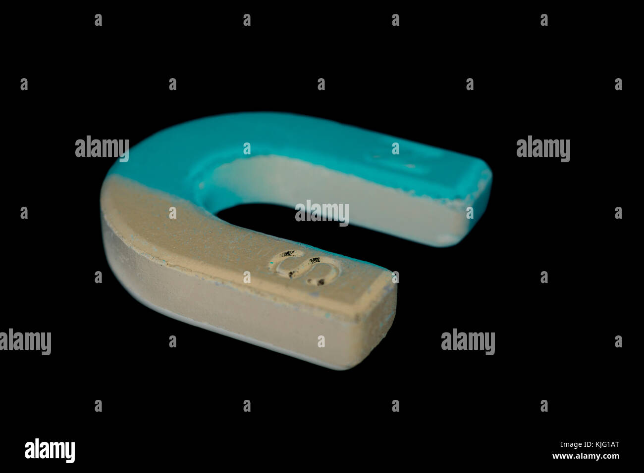 Magnet on black Stock Photo - Alamy