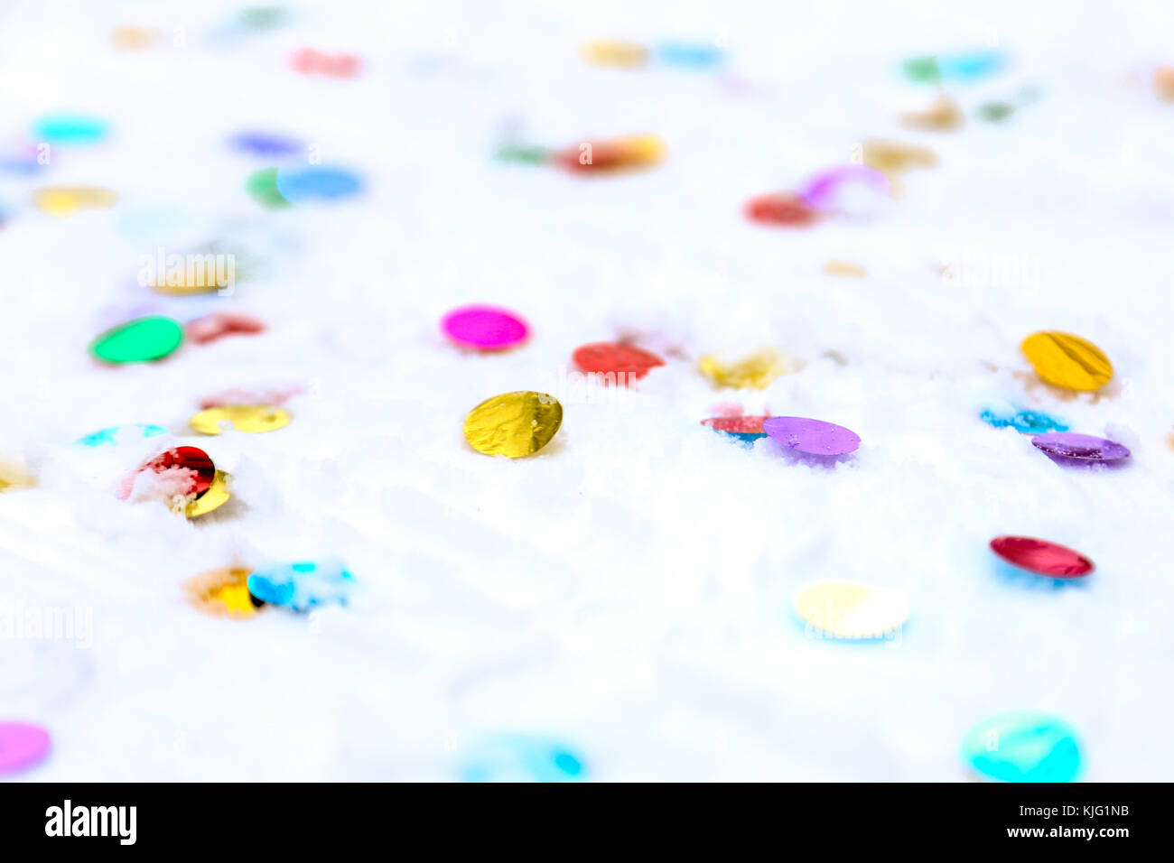 Photo of abstract colorful explosion of confetti on white snow outdoor ...