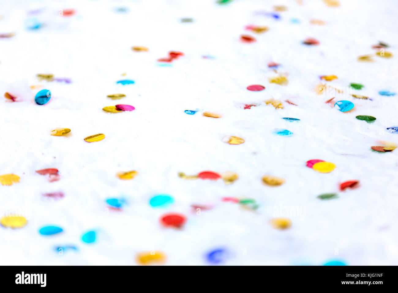 Photo of abstract colorful explosion of confetti on white snow outdoor ...