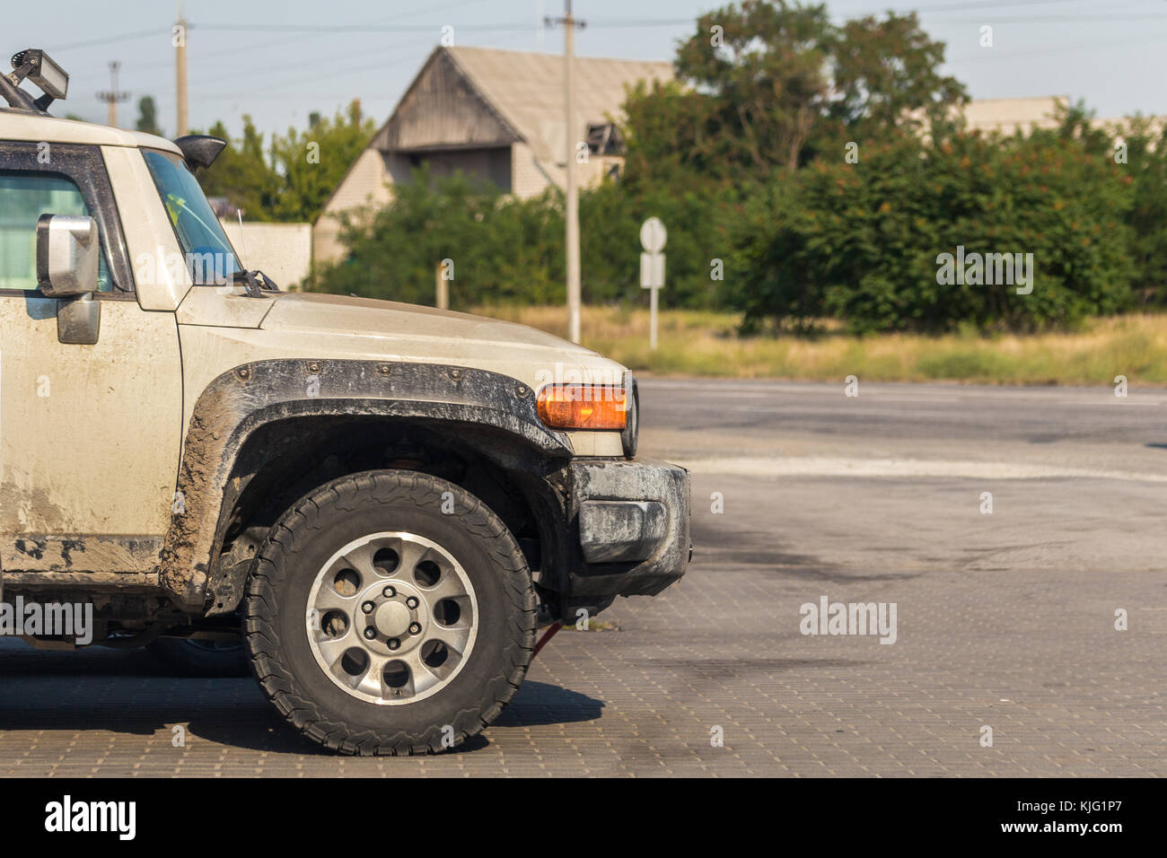 Side view of offroad car's wheel soiled in mud and dirt after trophy ...