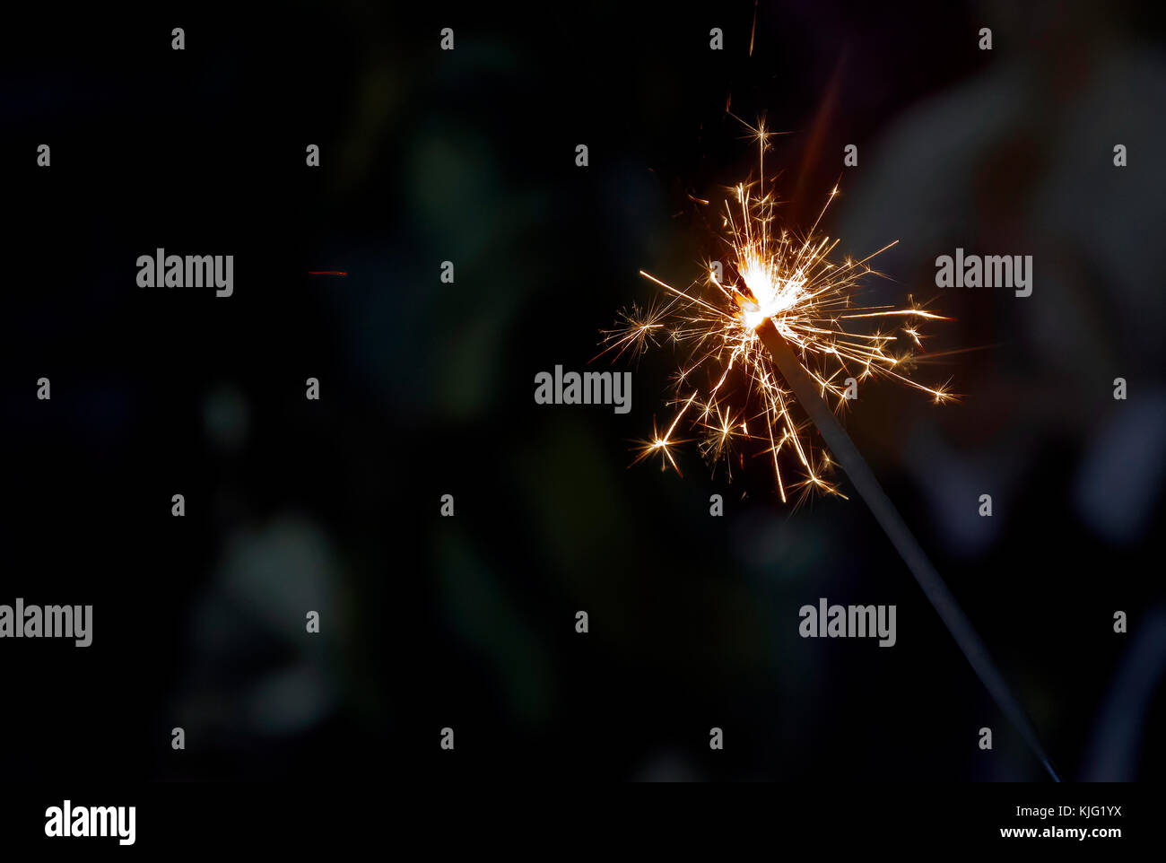 Glowing holiday sparkling hand fireworks, shining fire flame Stock ...