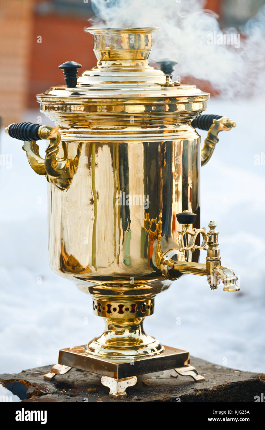 Vintage smoking golden Samovar, the traditional russian water boiler ...