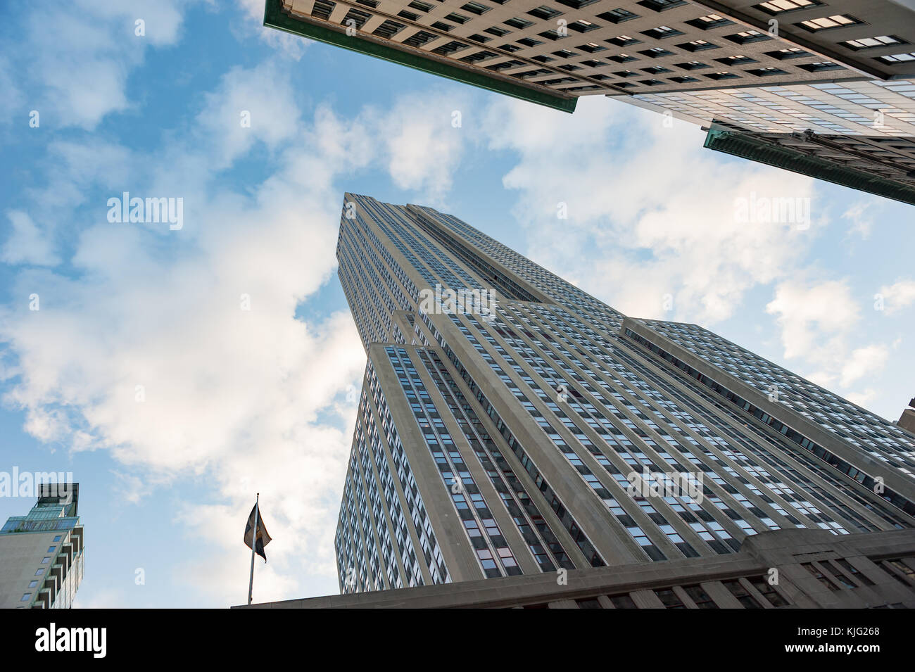 Empire State building low vertical view against blue sky Stock Photo ...