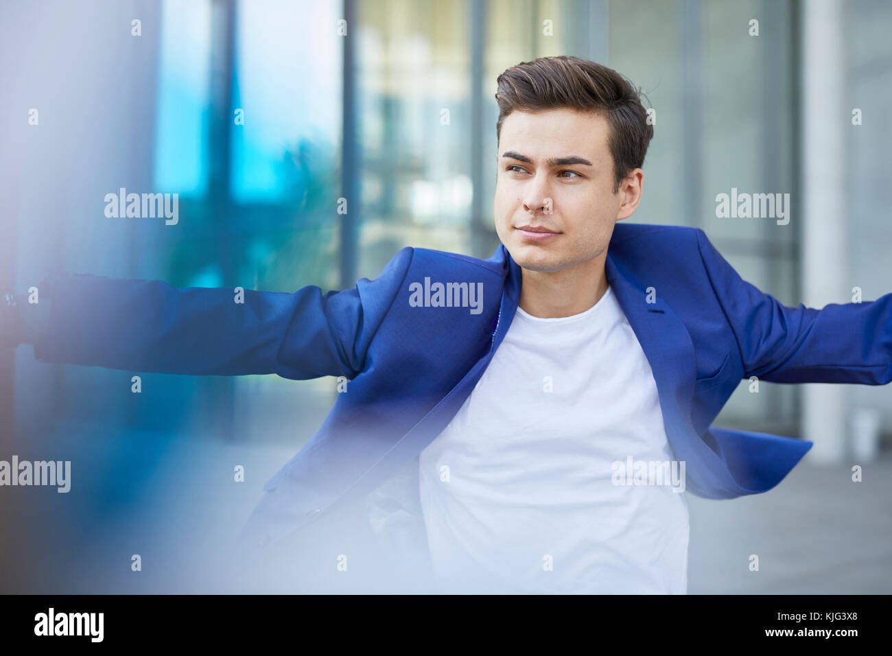 Young man wearing blue jacket hi-res stock photography and images - Alamy