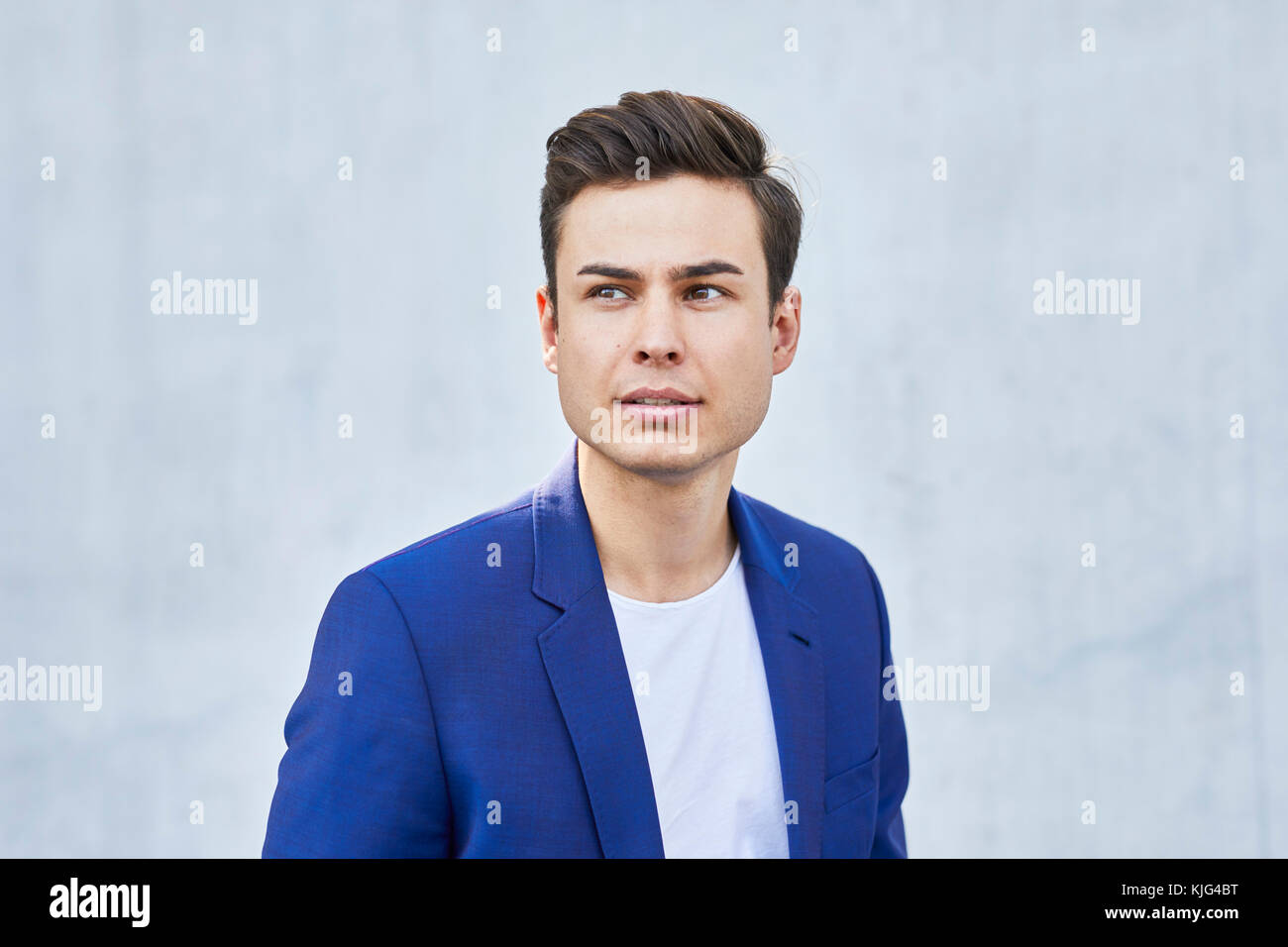 Young man wearing blue jacket hi-res stock photography and images - Alamy
