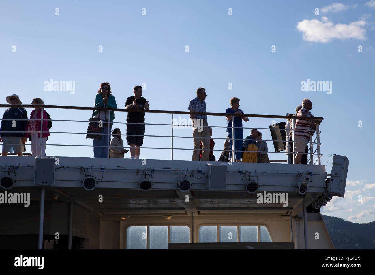 Cruise ship passengers on an open upper deck enjoying the view Stock ...