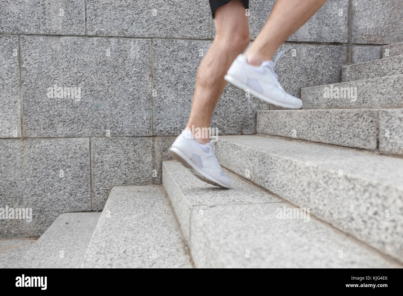 Close-up of man running on stairs Stock Photo - Alamy