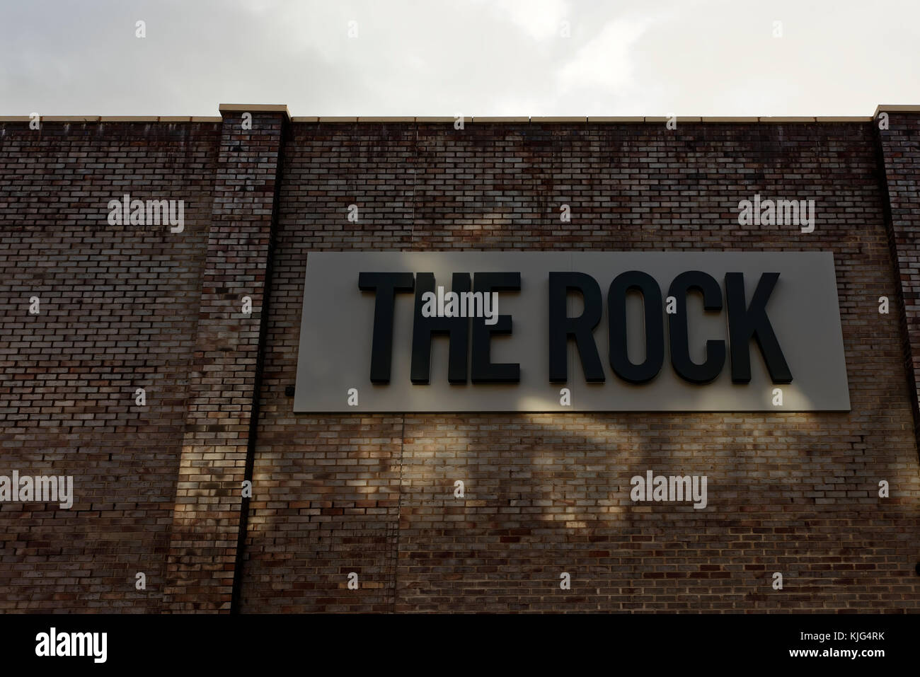 The Rock shopping centre exterior signage mounted on brick wall in bury ...