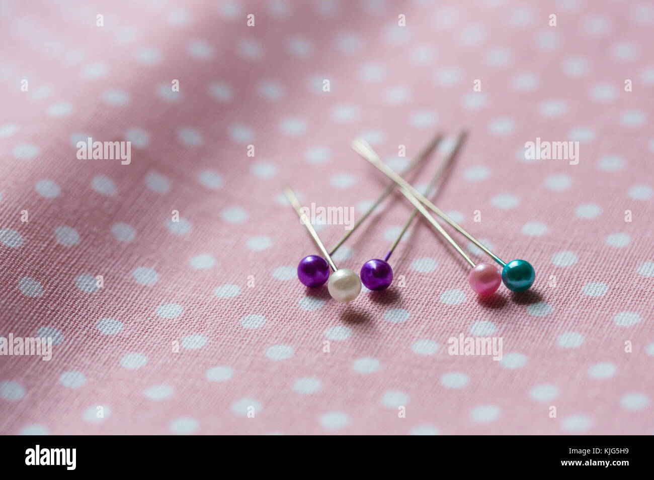 Fixing pins on cloth Stock Photo - Alamy