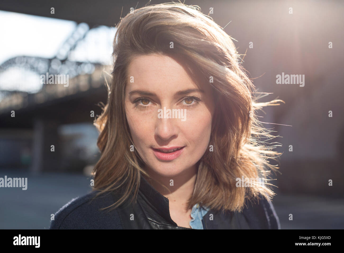 Portrait of woman with brown hair at backlight Stock Photo - Alamy
