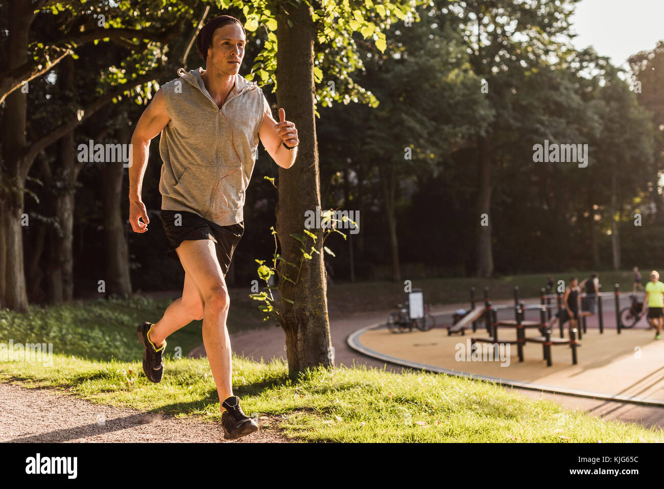 Man jogging in park Stock Photo - Alamy