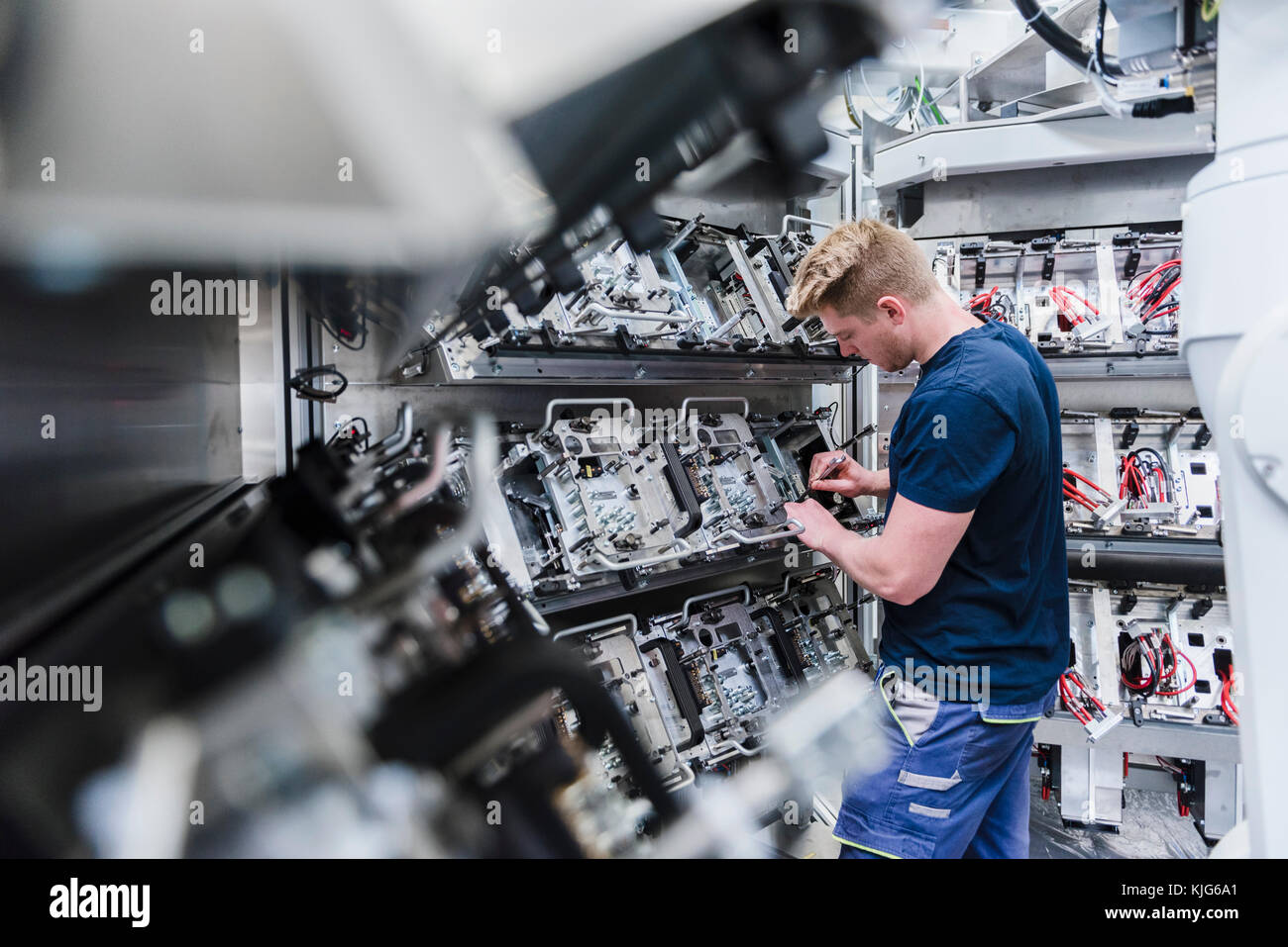 Man working in modern factory Stock Photo - Alamy