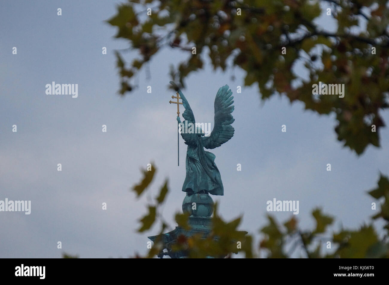 The Millennium Monument in Budapest seen between the trees Stock Photo ...