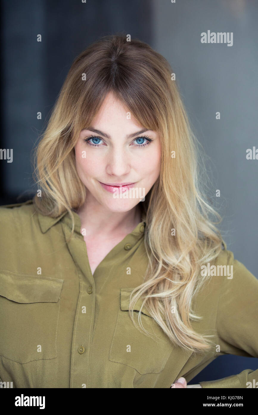 Portrait of smiling blond woman Stock Photo - Alamy