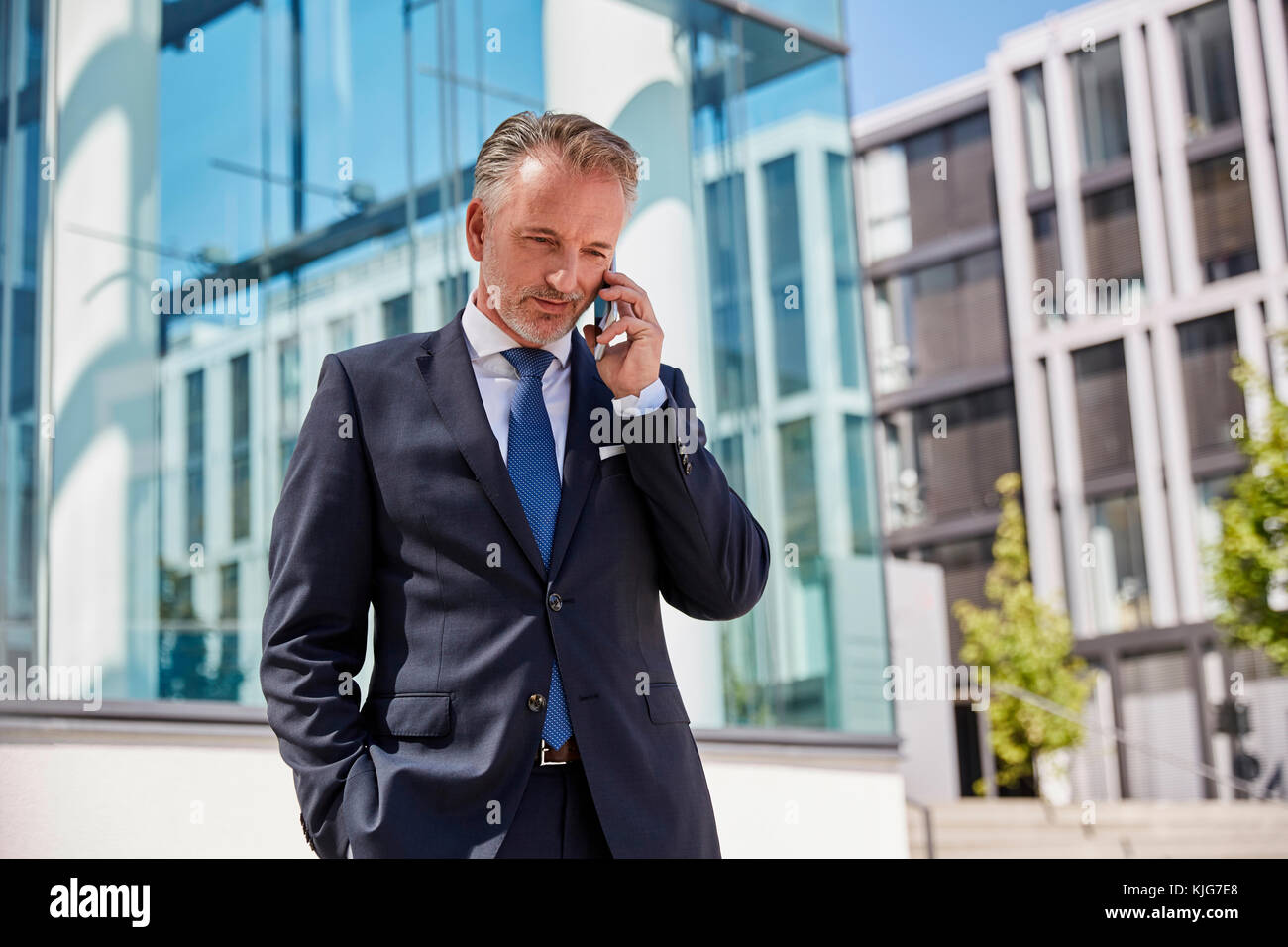 Portrait of businessman on the phone Stock Photo - Alamy