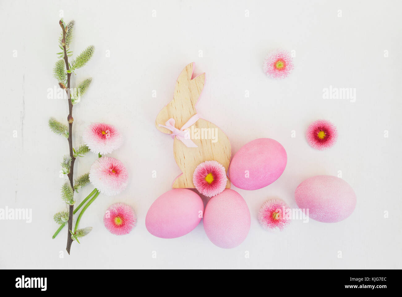 Hand dyed pink Easter eggs with bunny, daisy and catkin decoration on ...