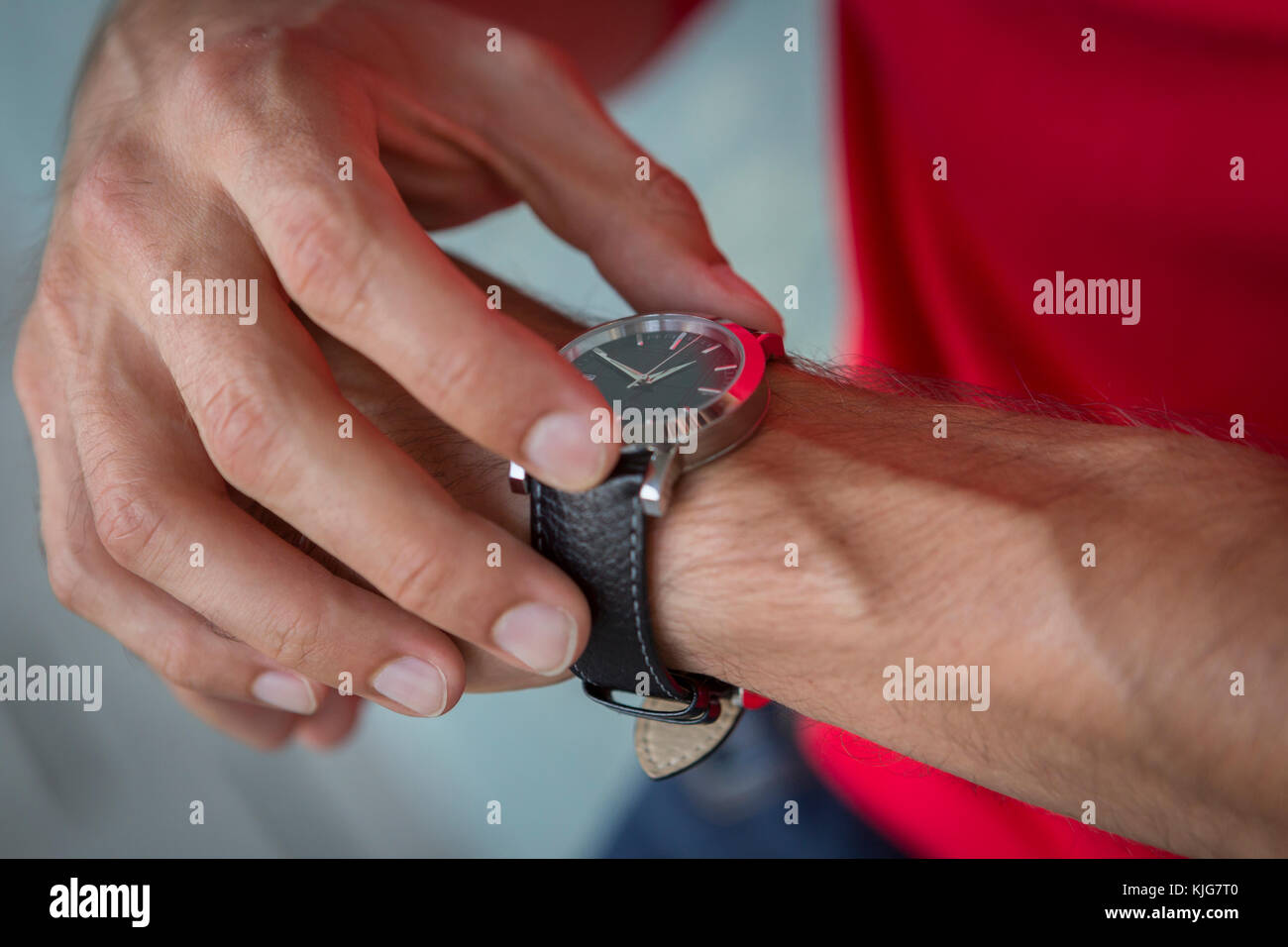 Hand men looking watch time hi-res stock photography and images - Alamy