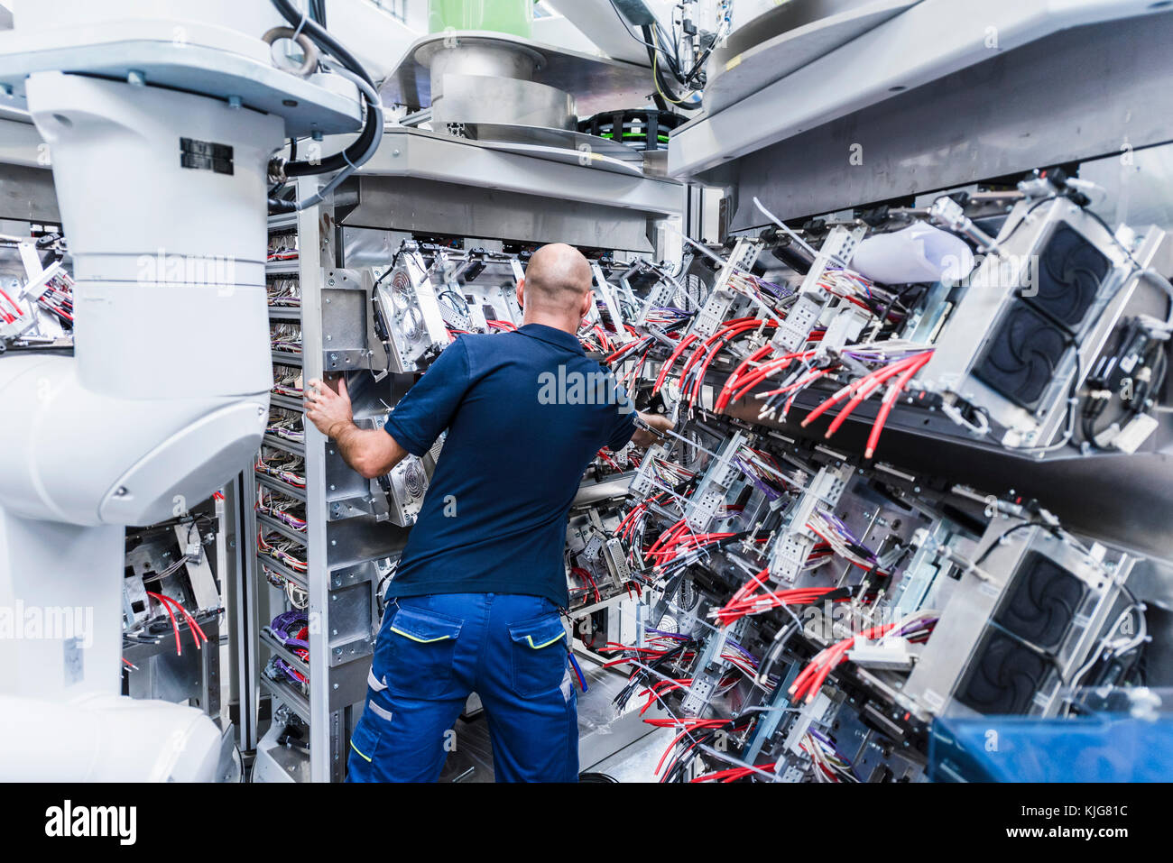 Man working in modern factory Stock Photo - Alamy