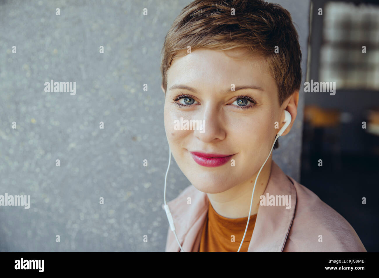 Portrait of woman with earphones Stock Photo - Alamy