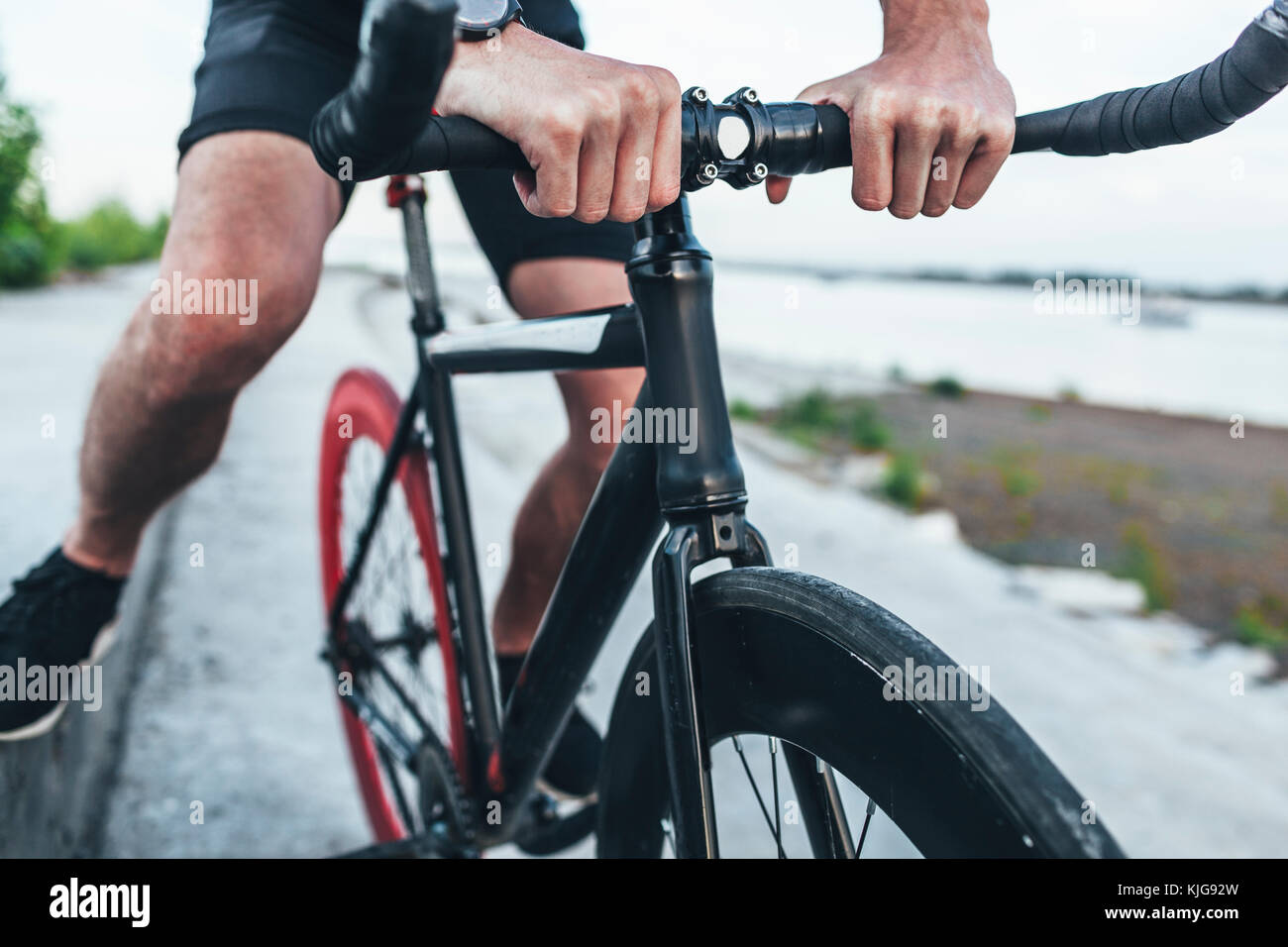 Close-up of young man on fixie bike Stock Photo - Alamy
