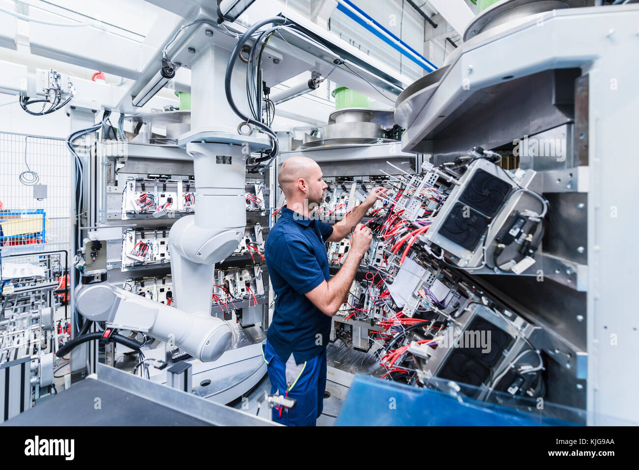 Man working in modern factory Stock Photo - Alamy