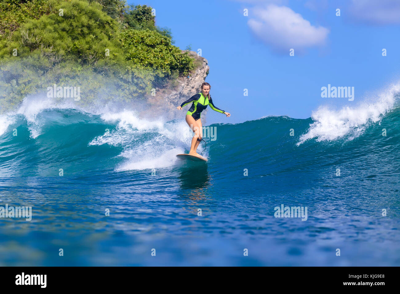 Indonesia, Bali, woman surfing Stock Photo - Alamy
