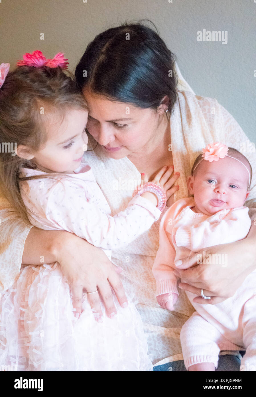 Mother with two daughters posing for lifestyle family portrait Stock ...