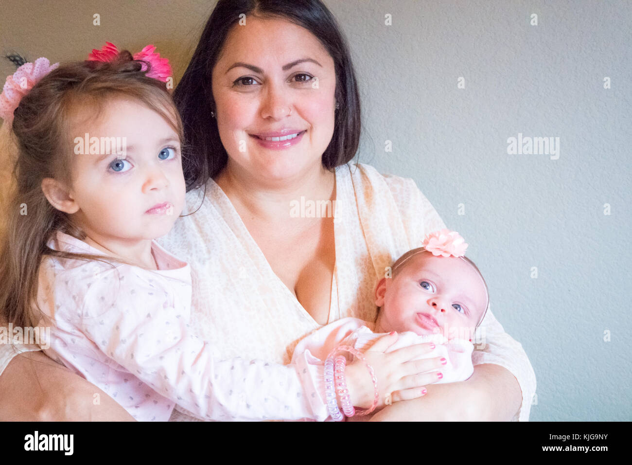 Mother with two daughters posing for lifestyle family portrait Stock ...